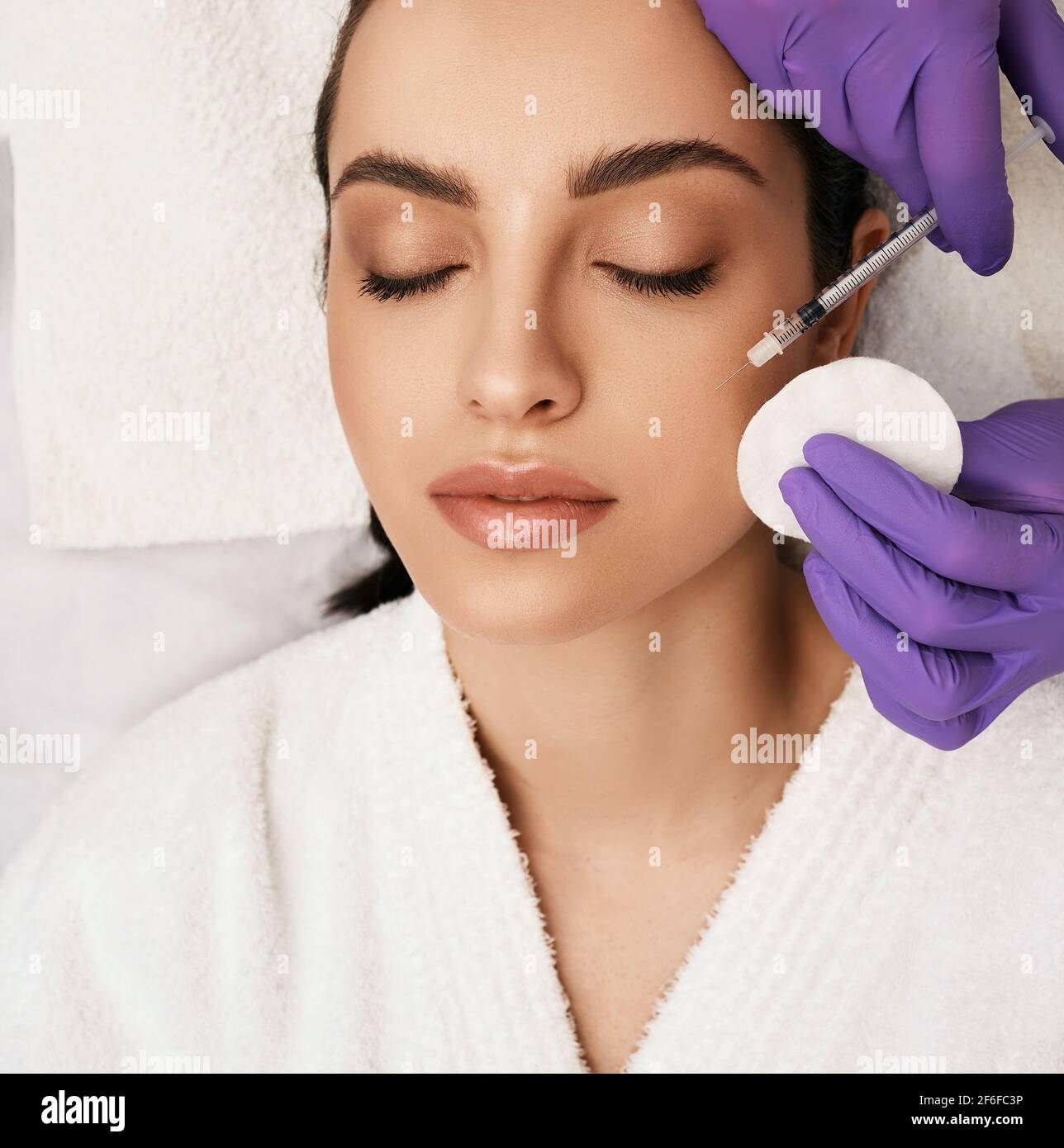 Beautiful woman having eye wrinkle injection, close-up. Facial ...