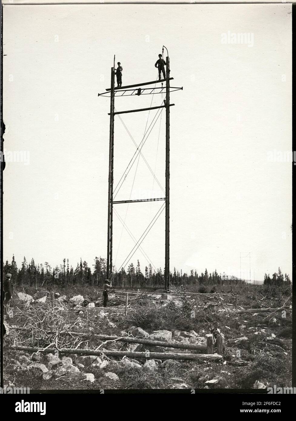 Final mounting of mast for high voltage lines Stock Photo - Alamy