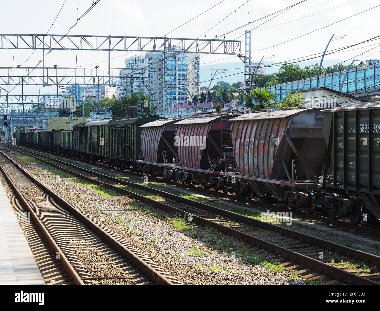 Russia, Sochi18.07.2020. A long freight train with different wagons ...