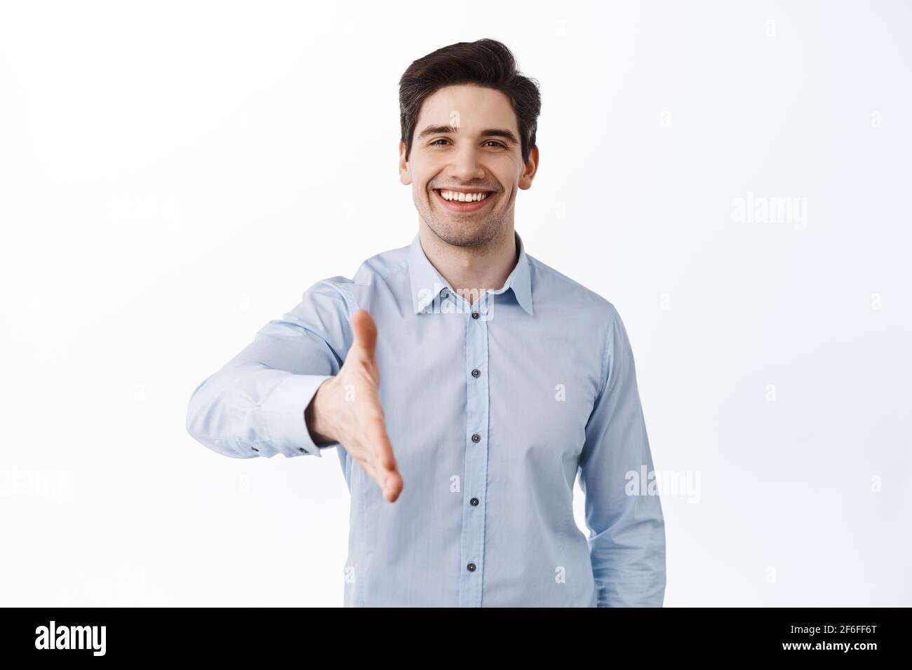 Nice to meet you. Handsome businessman stretch out hand for handshake ...