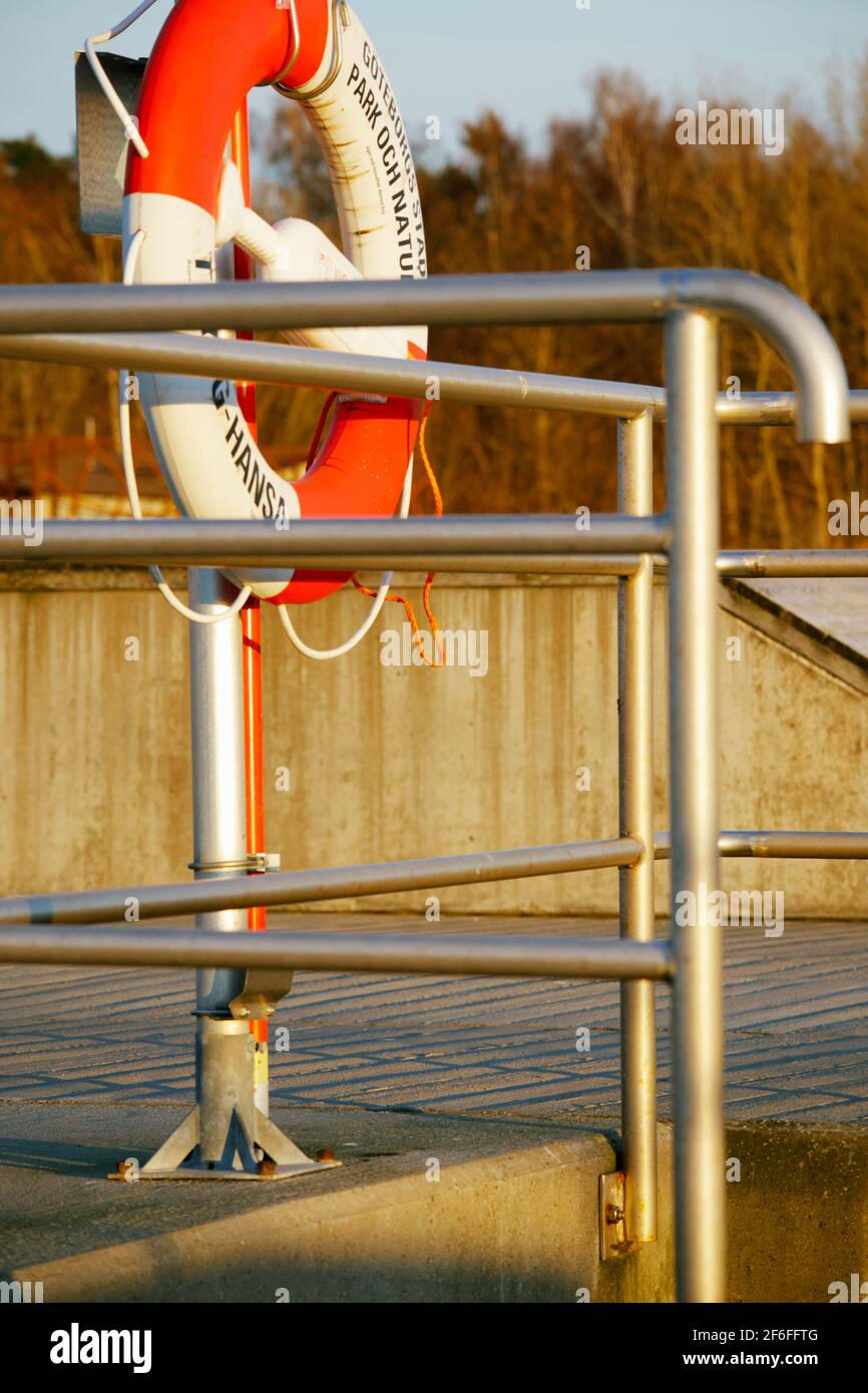 White and red lifebuoy at the bathing beach in spring Stock Photo - Alamy