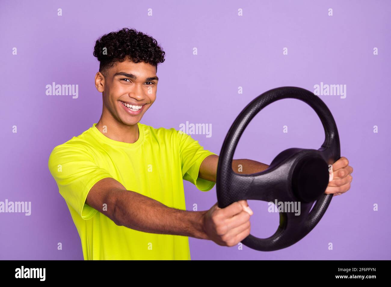 Photo of young handsome attractive positive smiling african man holding ...