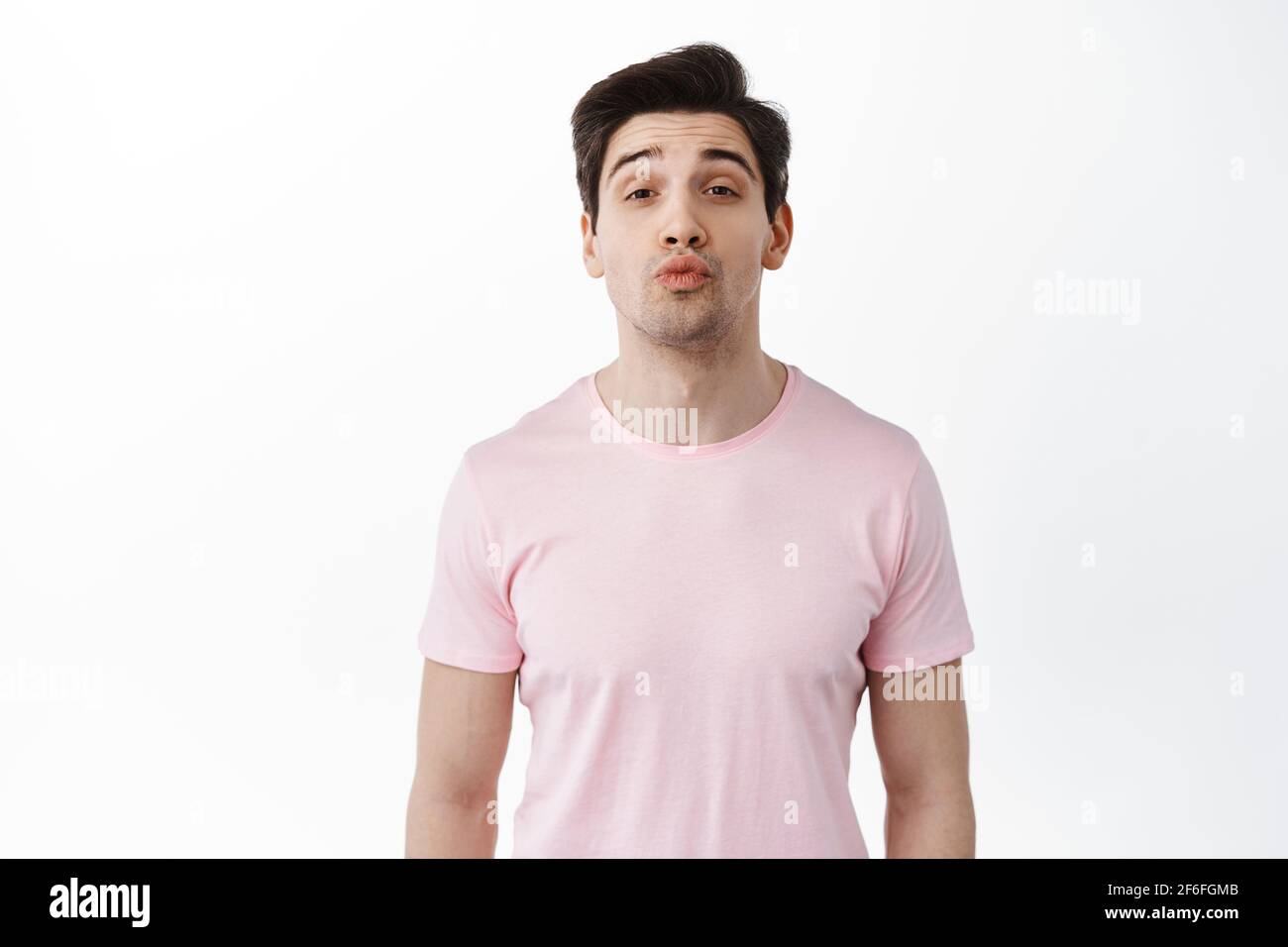 Just one kiss. Cute man pucker lips and waiting for kissing, looking ...