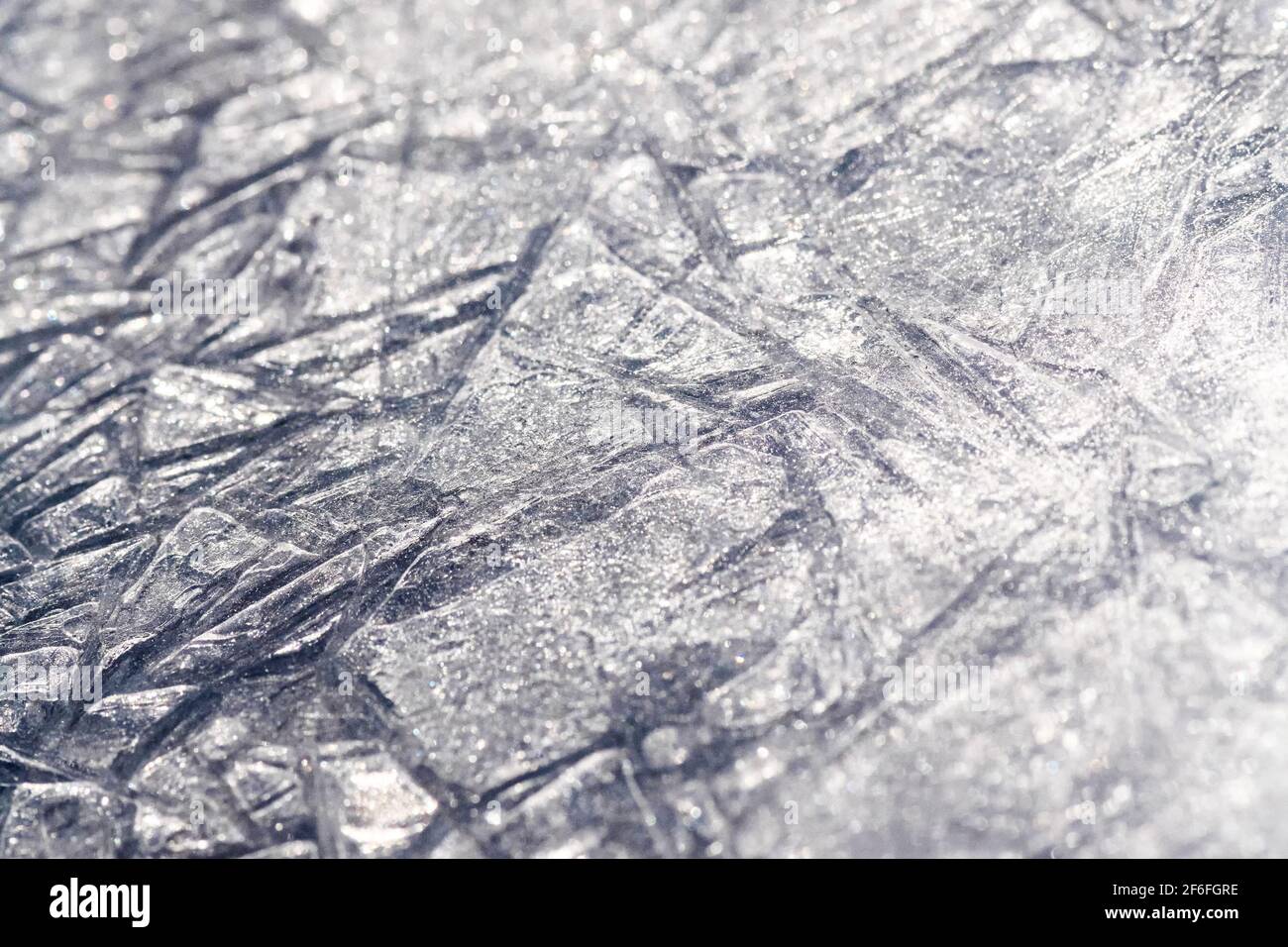 In the sun glisten Transparent ice crystals texture cracked background ...