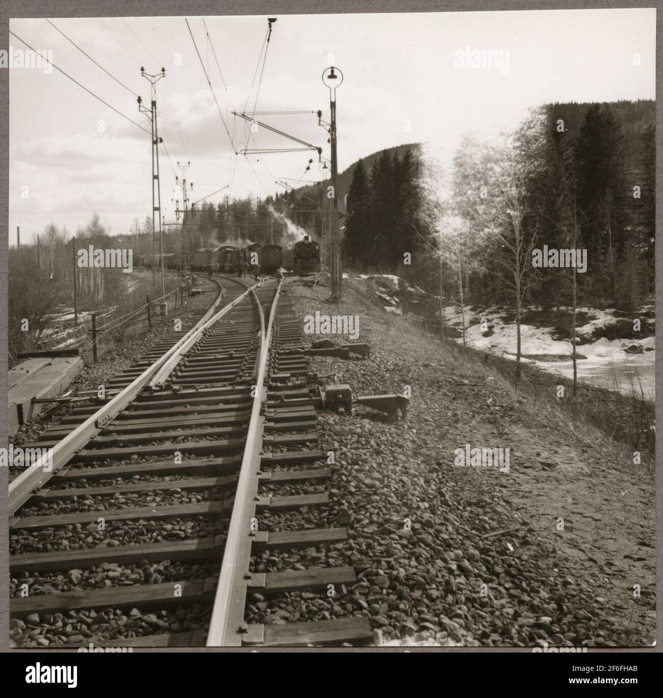 Almost in the middle of the picture, the steam locomotive is seen the ...