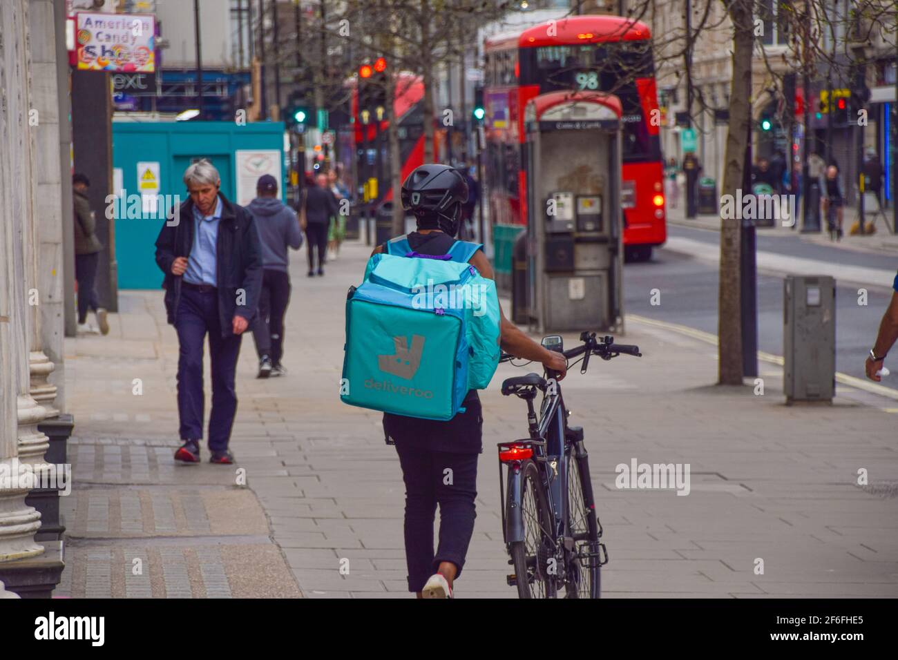London, United Kingdom. 31st March 2021. A Deliveroo rider on Oxford ...