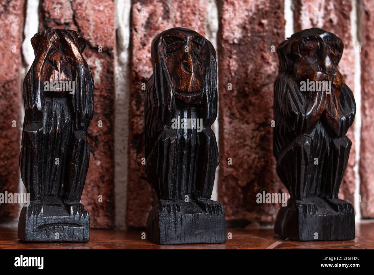 Carved wooden sculptures of the three wise monkeys, embodying the ...