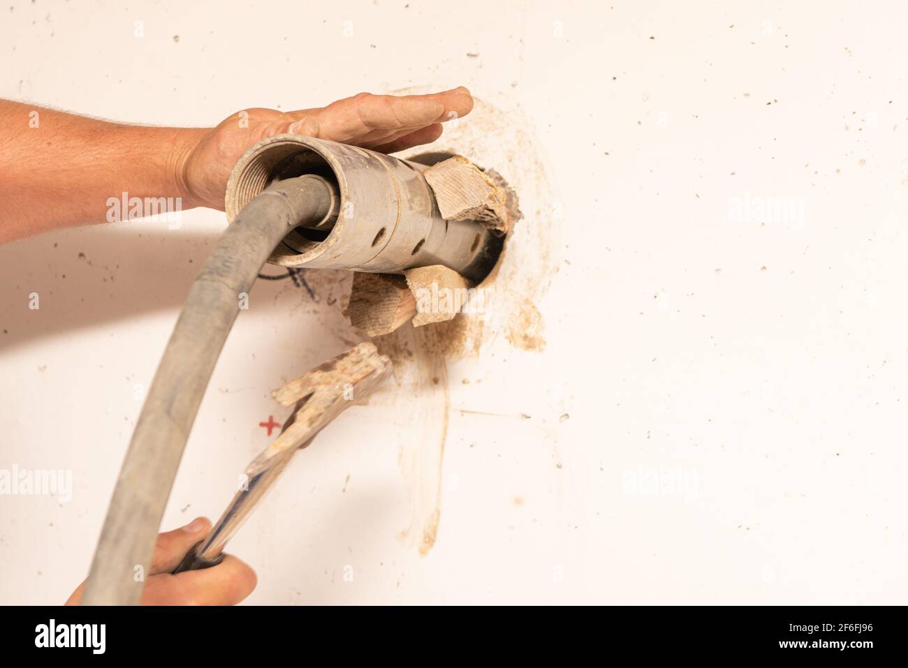 A wall breakthrough through a core drilling by professionals with the ...