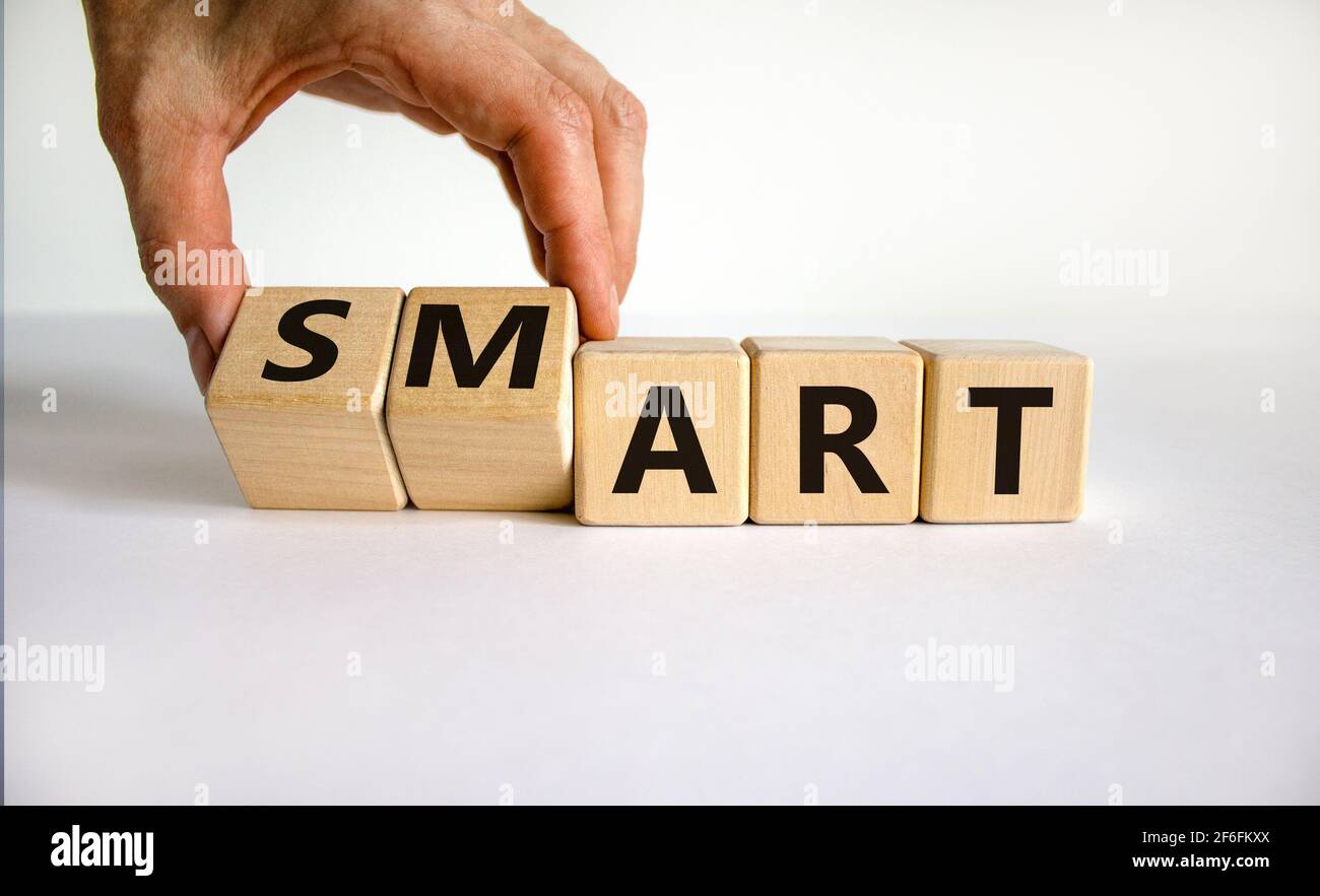 Smart art symbol. Businessman turns cubes and changes the word 'smart ...