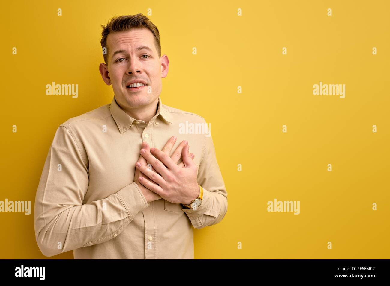 Kind Man Greeting, Expressing Gratitude Holding Hands On Chest, Smiling ...