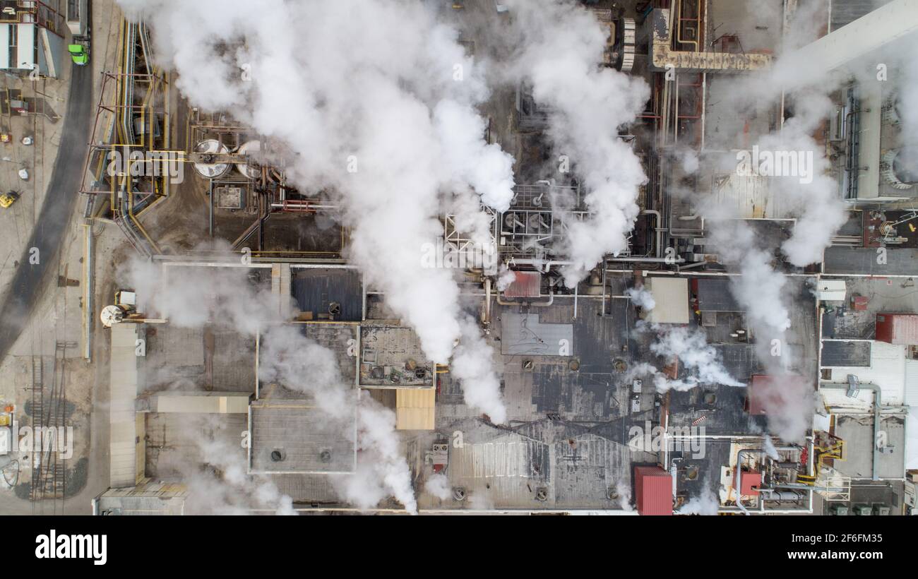 aerial view of a factory with smoking coming out Stock Photo - Alamy