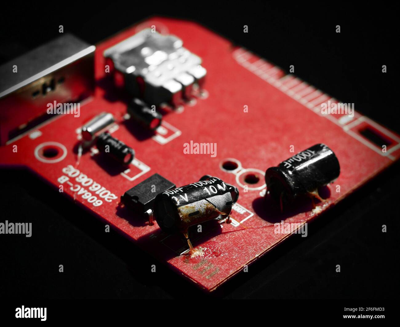 Red circuit board on black background Stock Photo - Alamy