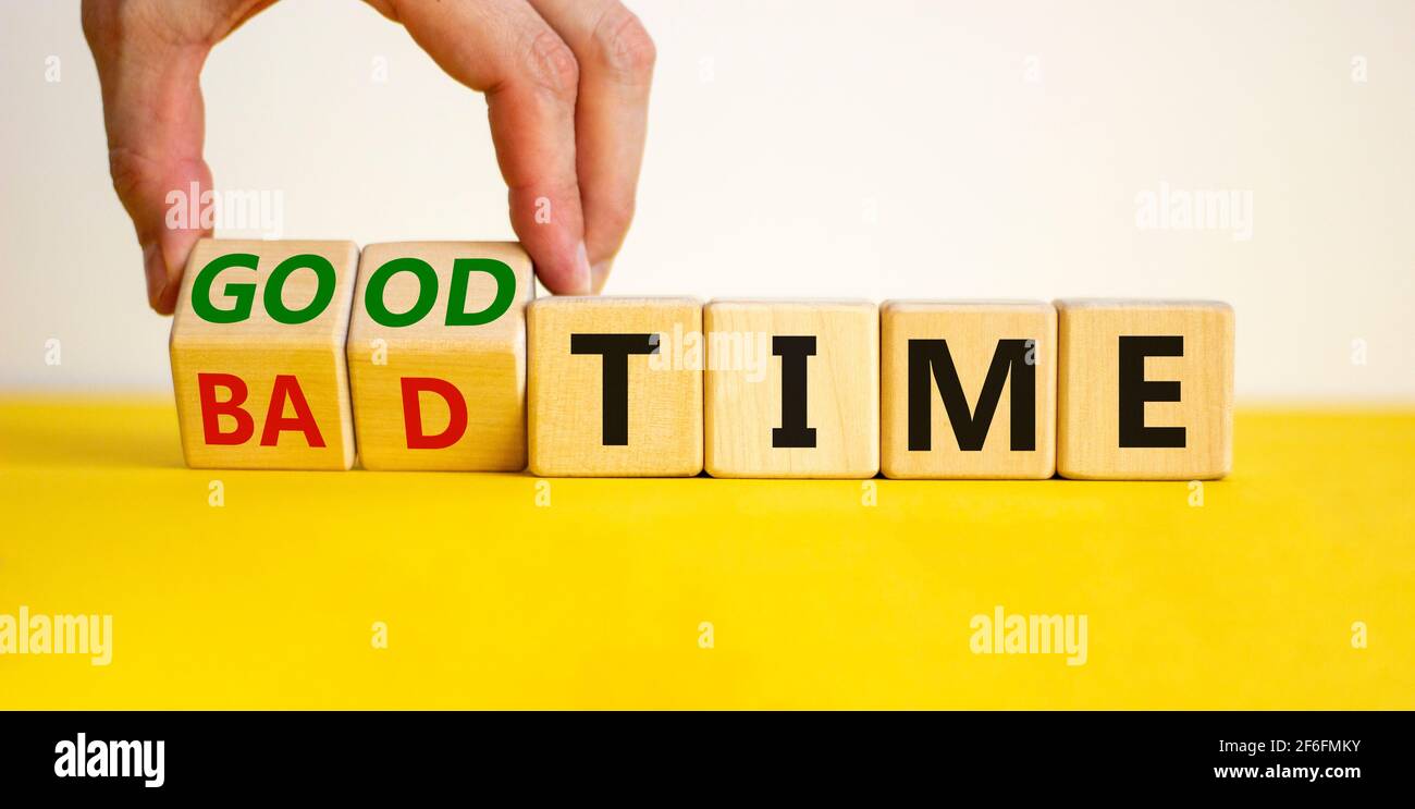 Good or bad time symbol. Businessman turns wooden cubes and changes ...