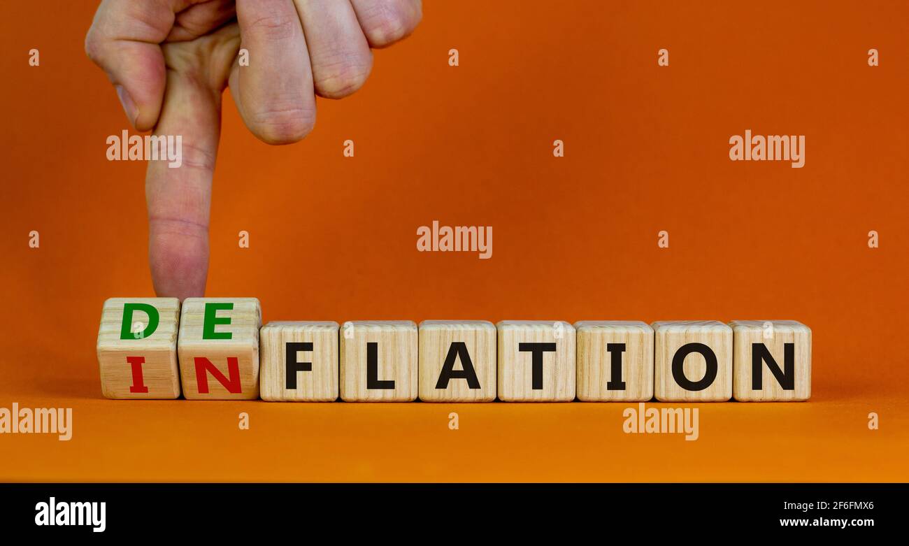 Inflation or deflation symbol. Businessman turns cubes and changes the ...