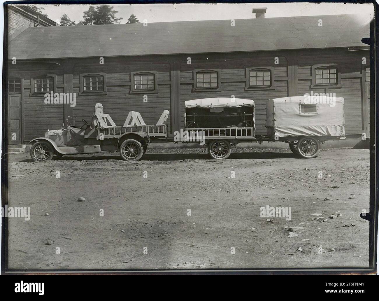 Car with trailer at goods magazine Stock Photo - Alamy