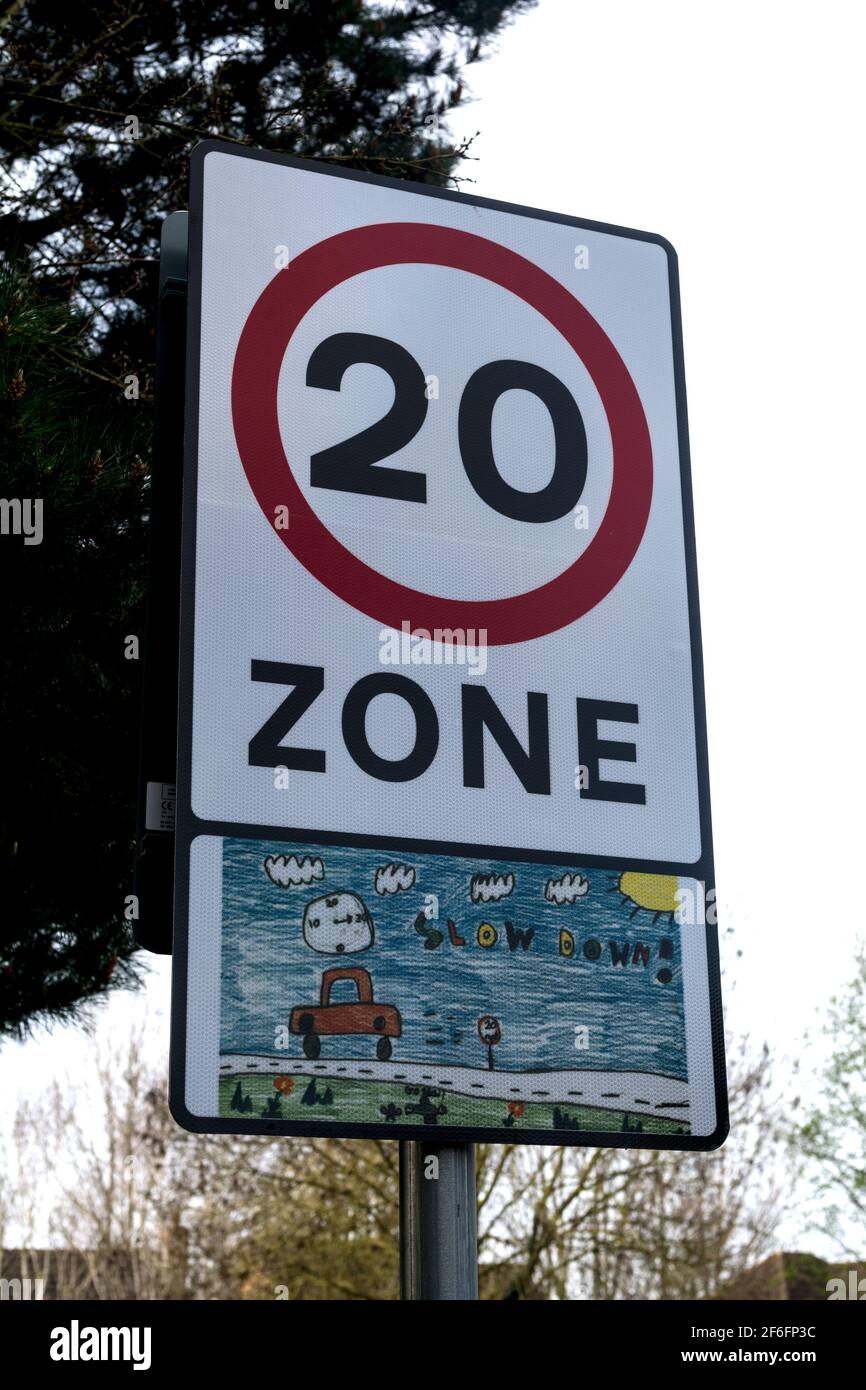 20 mph zone sign with children`s picture, Warwick, UK Stock Photo - Alamy