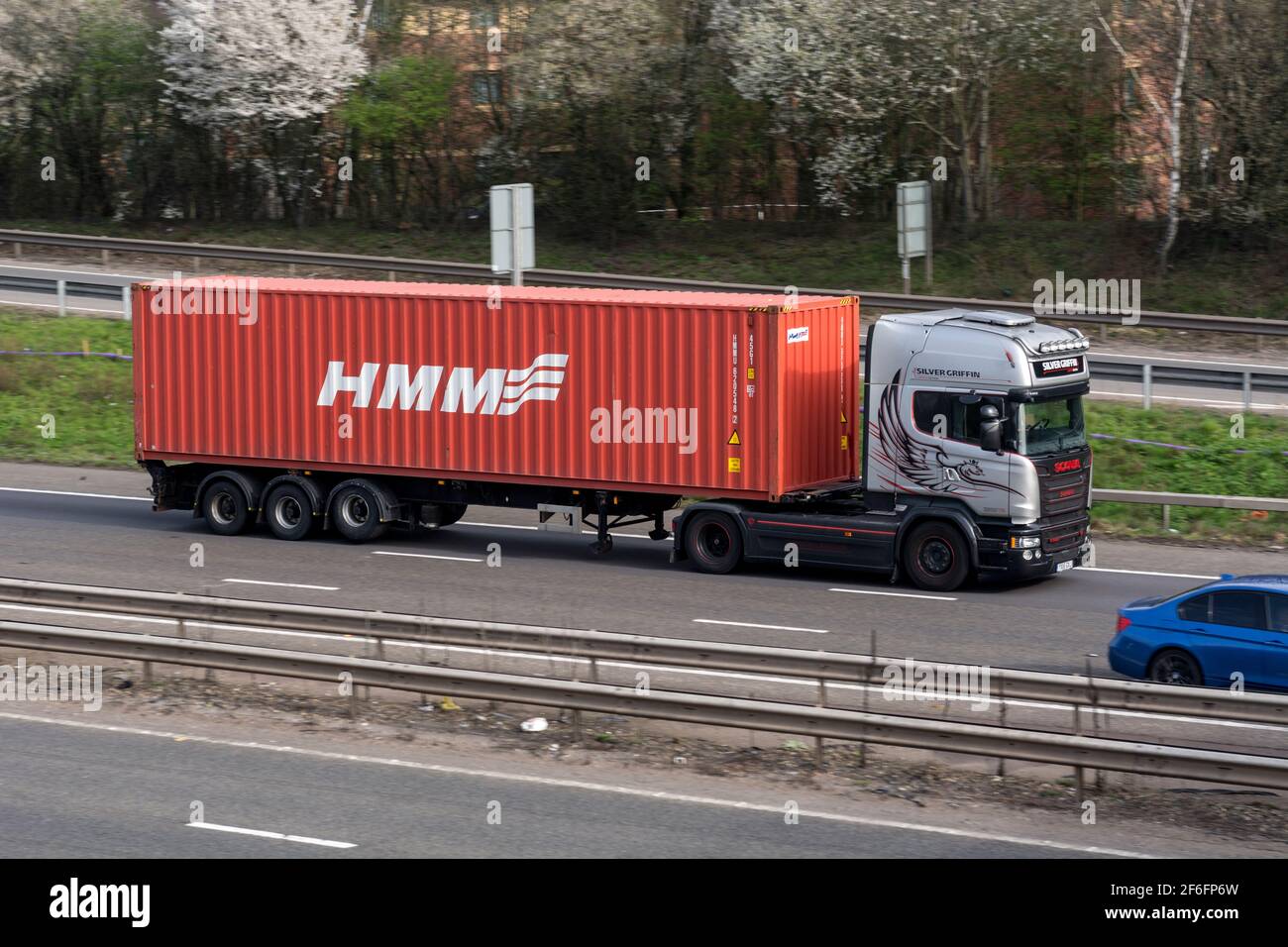 A HMM shipping container on a Silver Griffin lorry, M40 motorway ...