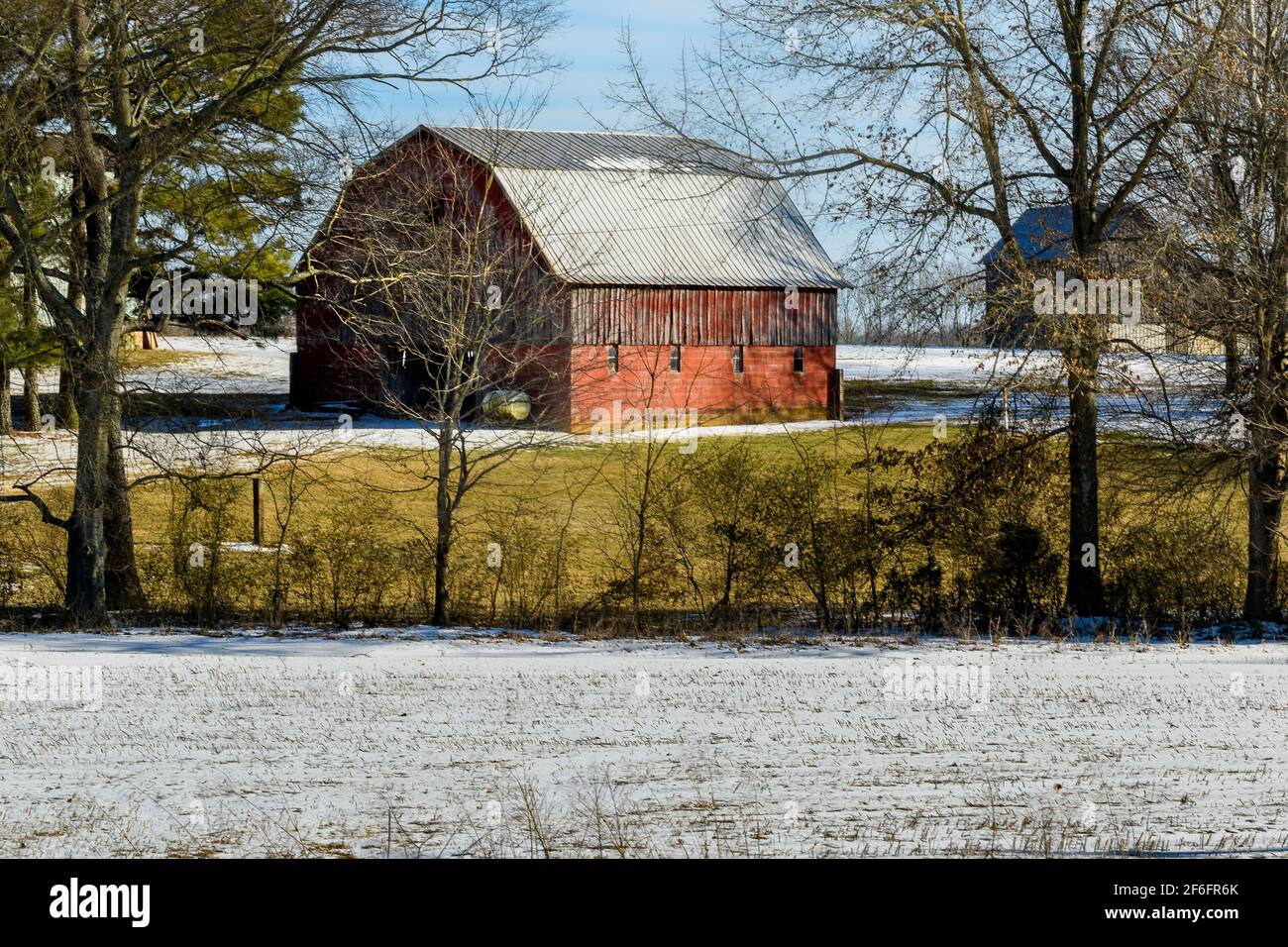 Red barn in a snowy field Stock Photo - Alamy