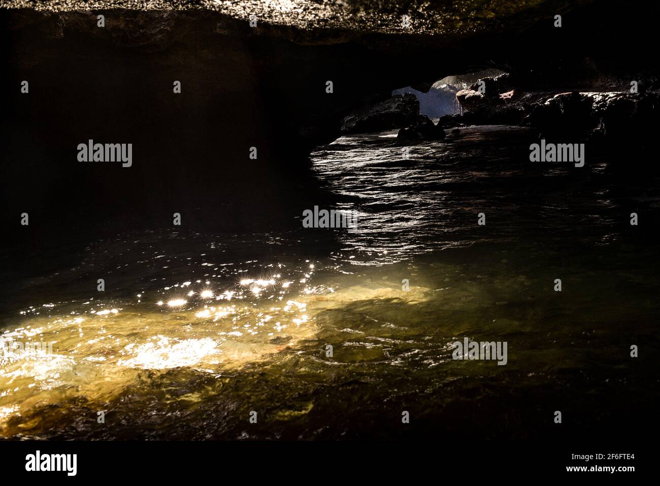 Spectacular Mermaid Caves with sunlight piercing through hole in ...