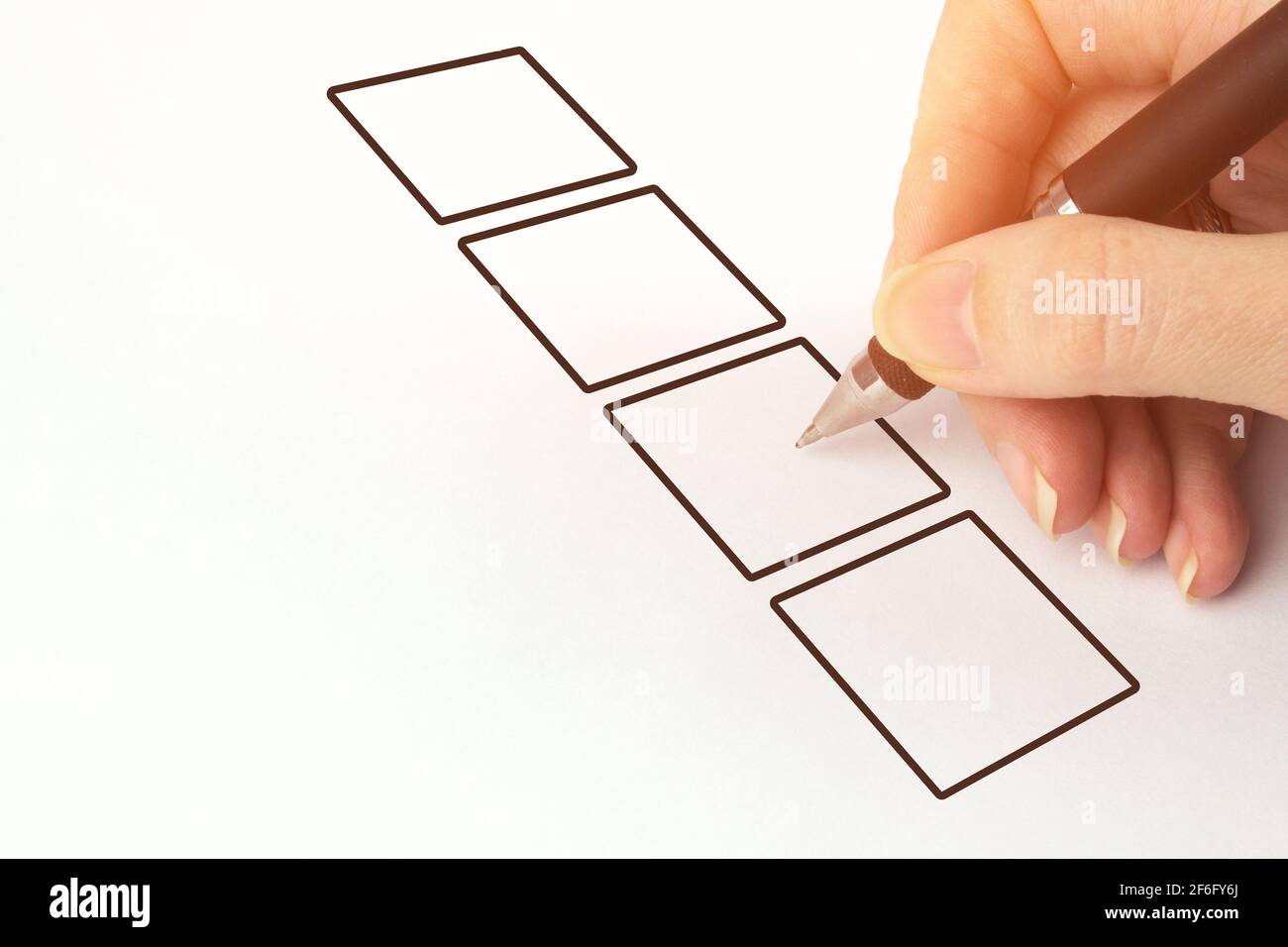 Hand with pen and check boxes on white background Stock Photo - Alamy
