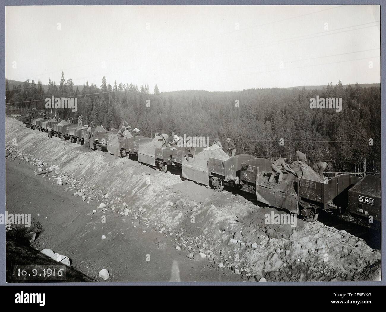 Tipping sand at the bridge building over the Öräre. The two freight ...