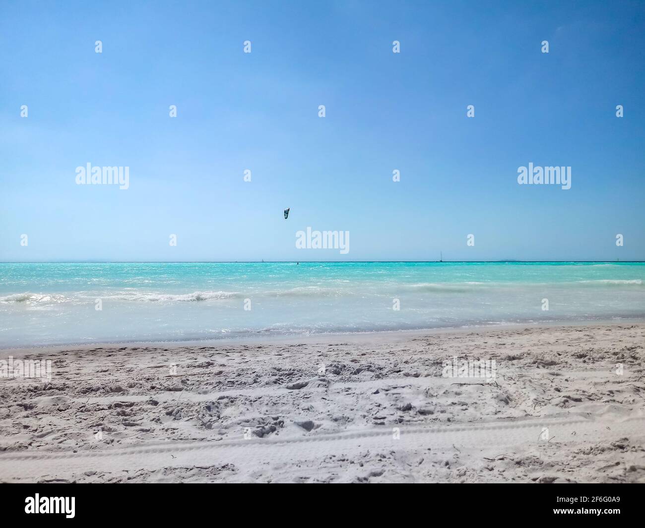 Kite surfing on the White Beach Rosignano Solvay with Caribbean-blue ...