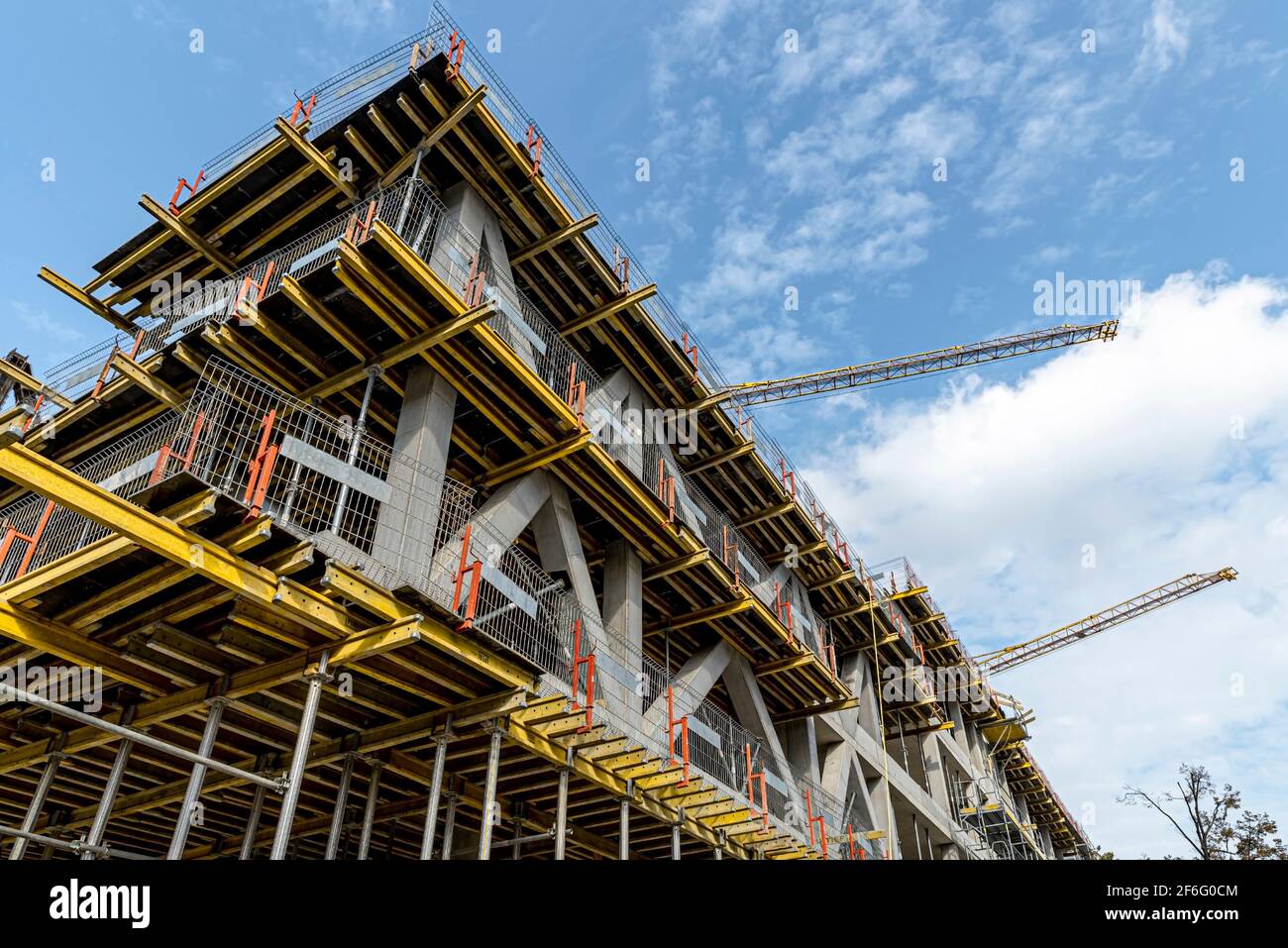 Office or apartment building under construction with scaffolding and ...