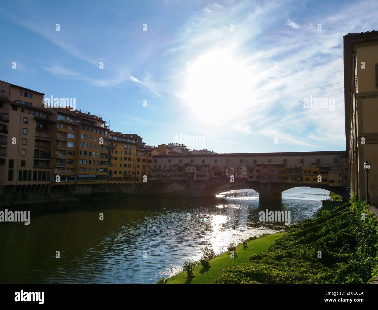 Famous Ponte Vecchio closed-spandrel segmental arch bridge across river ...
