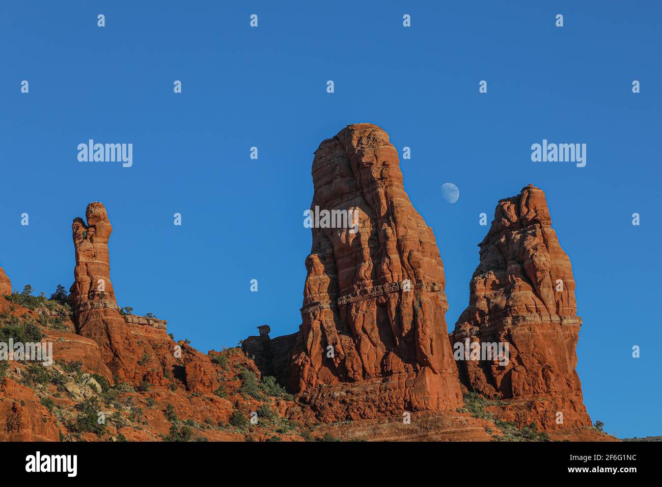 Moon rising over the red rocks of Sedona Arizona against a beautiful ...