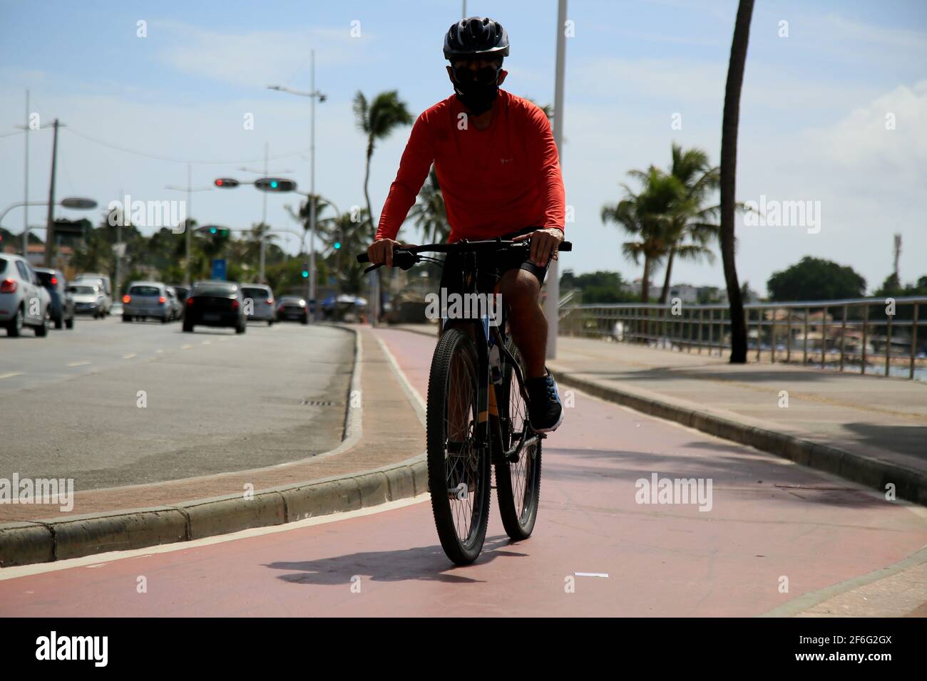 salvador, bahia, brazil - december 21, 2020: a cyclist is seen riding a ...