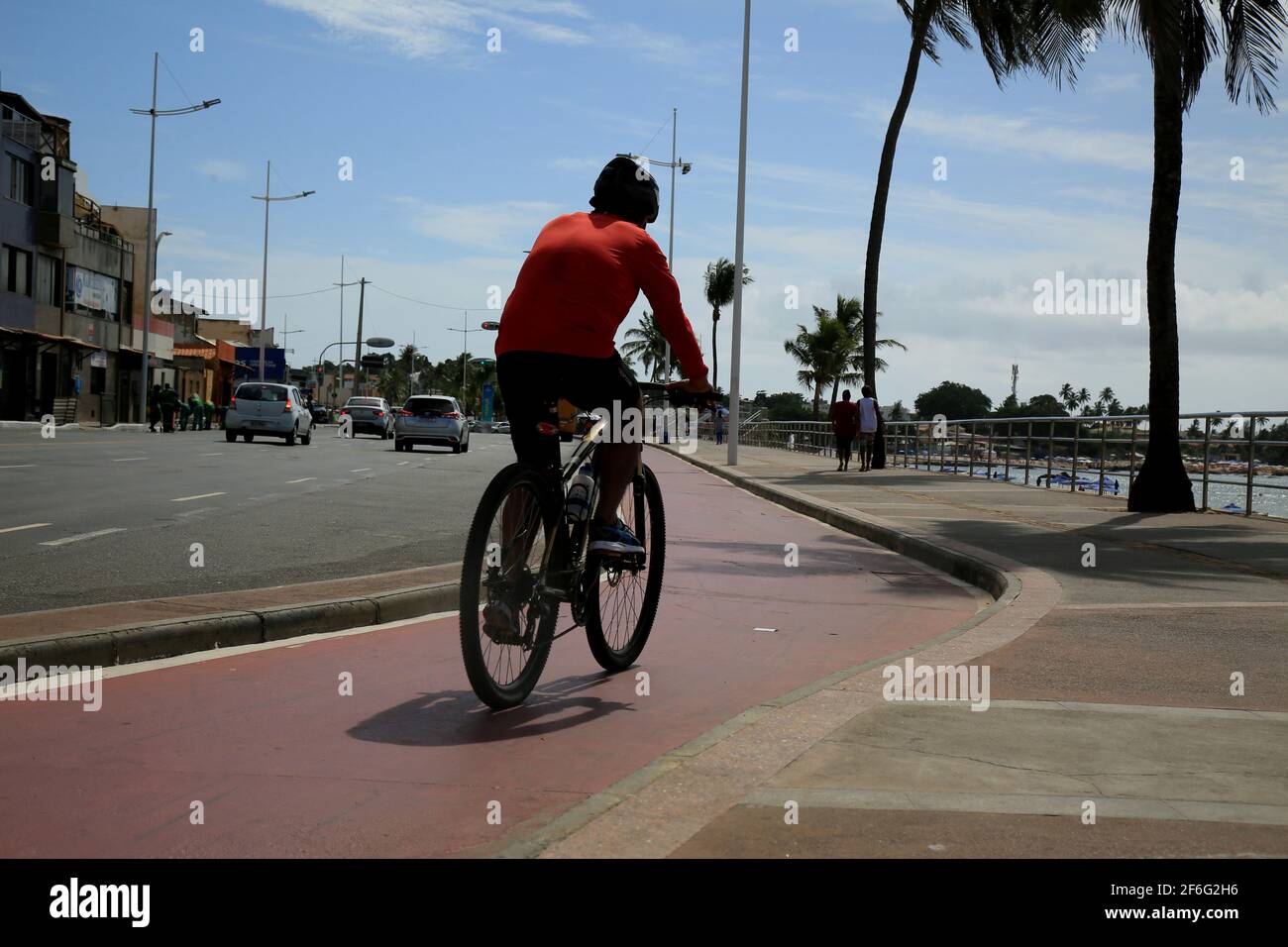 salvador, bahia, brazil - december 21, 2020: a cyclist is seen riding a ...