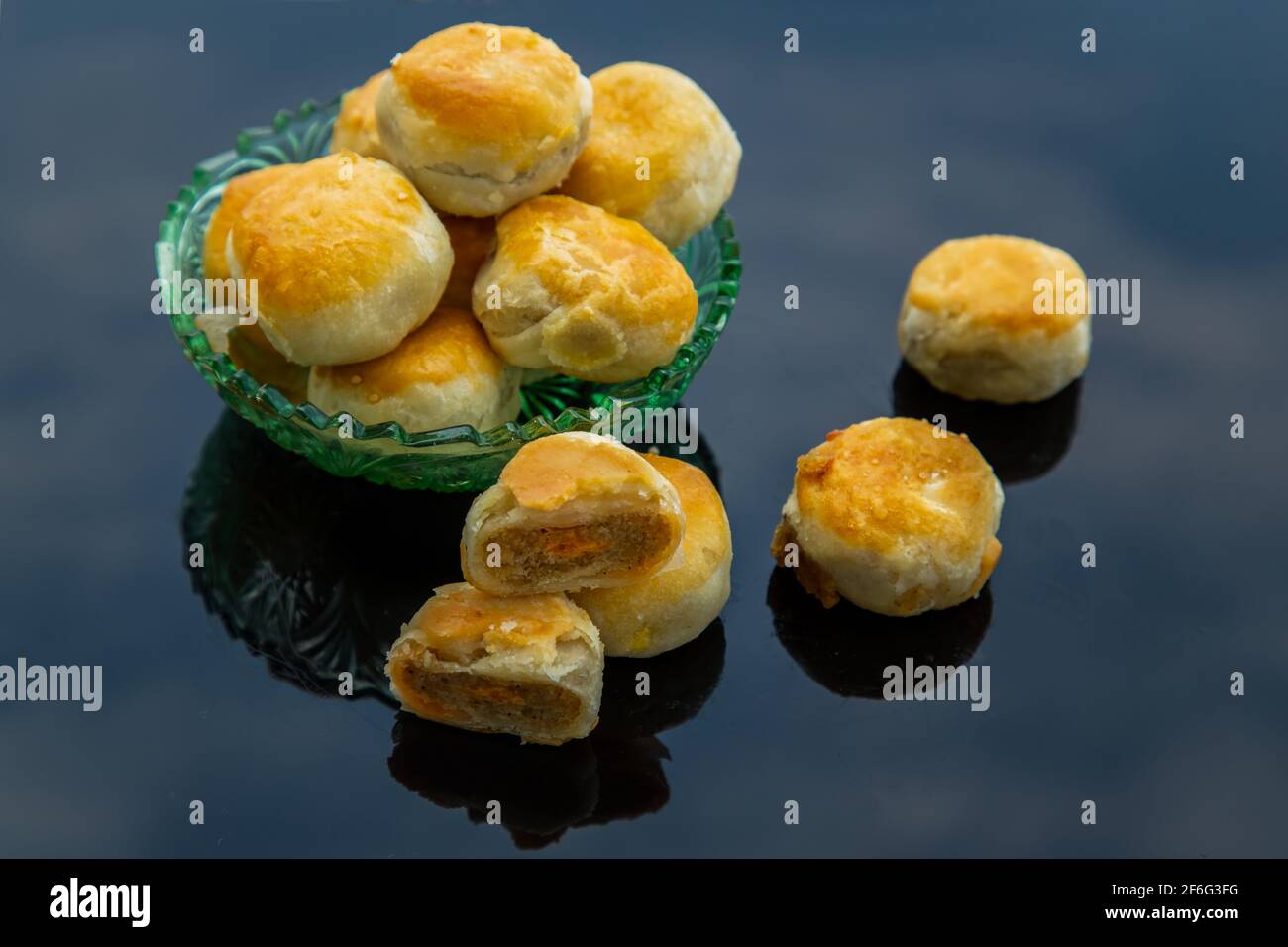 A traditional asian pastry or Tao Sor on black background. Chinese ...