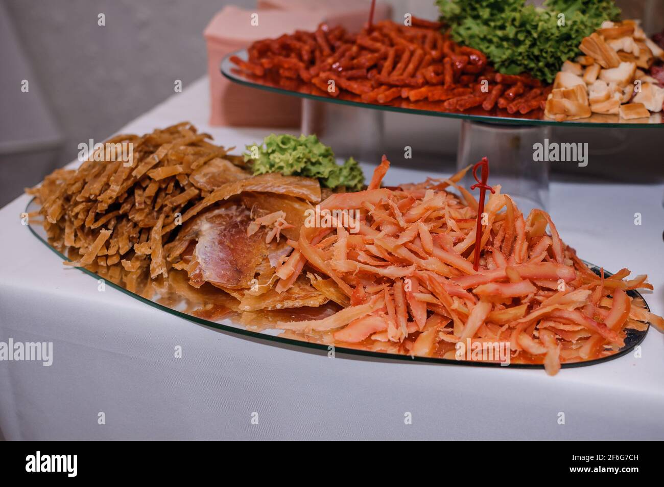 Dried fish and squid, beer snack Stock Photo - Alamy