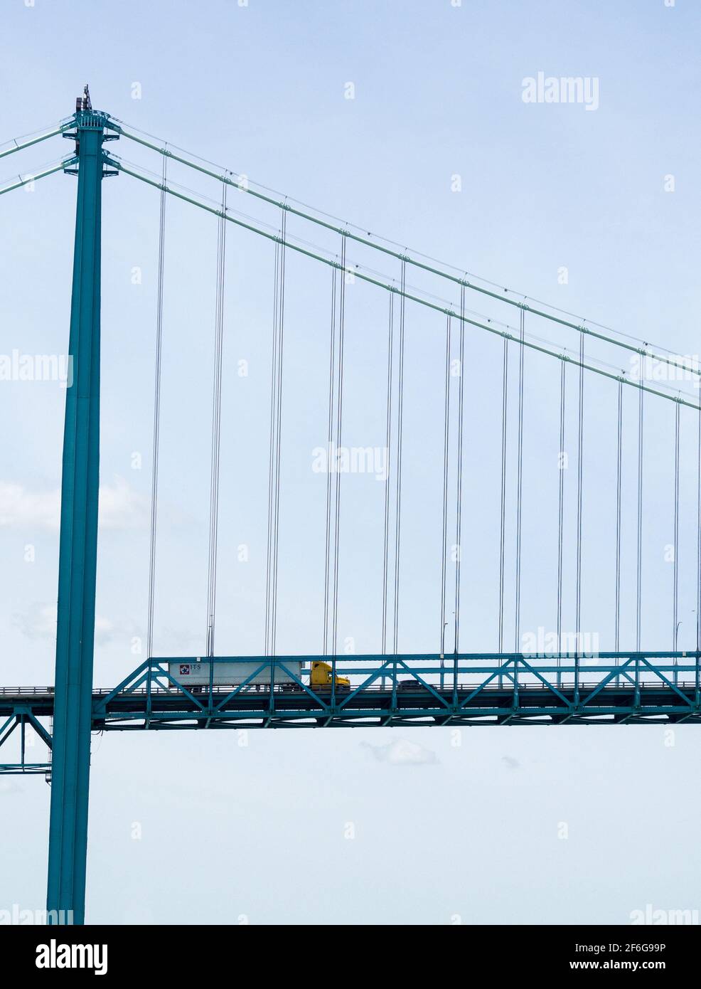 Truck Crossing to the USA via the Ambassador Bridge: A yellow cabed ...
