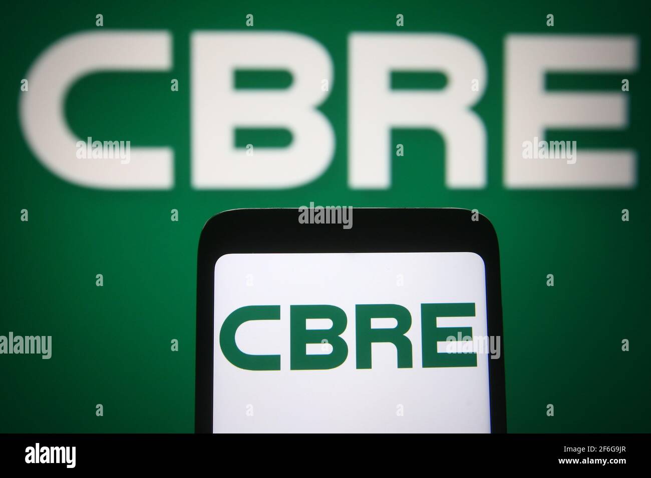 In this photo illustration, the CBRE Group logo of the real estate ...