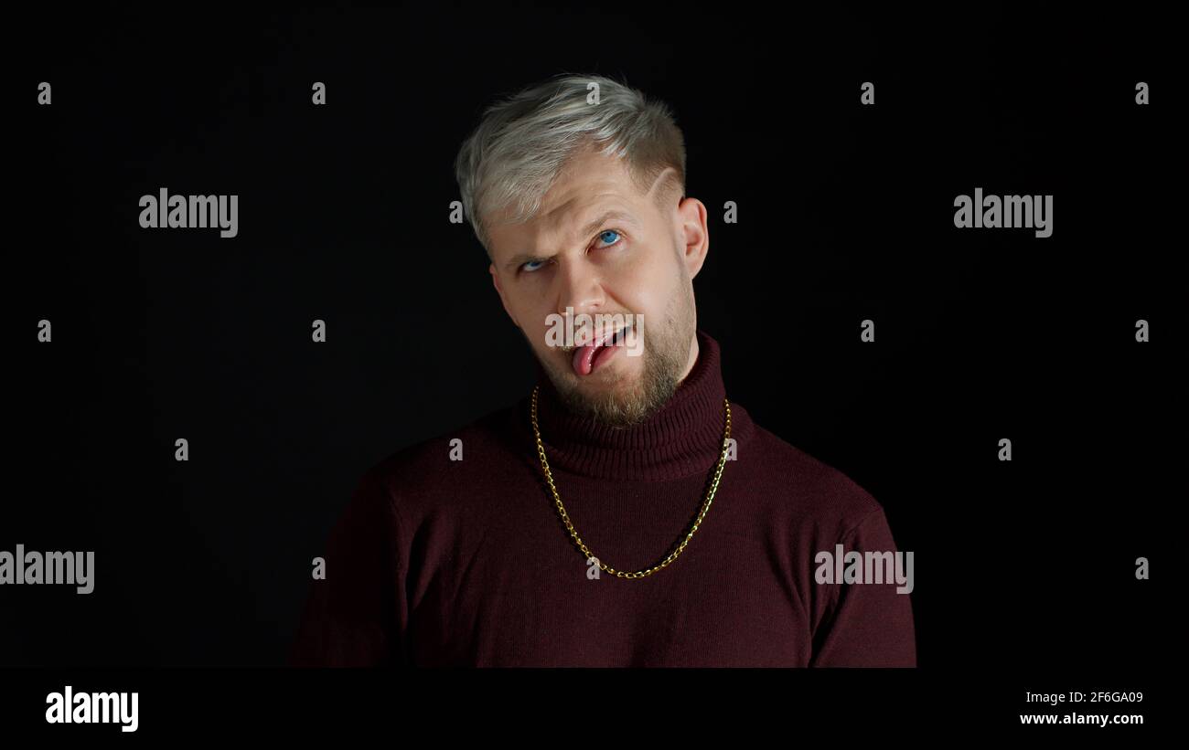 Comical stupid stylish man making funny silly face grimace, playing ...