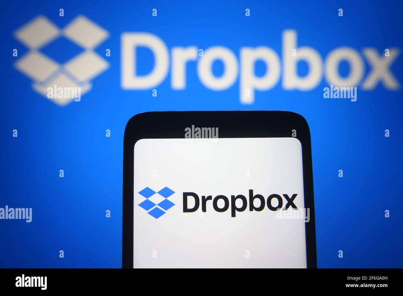 In this photo illustration, the Dropbox logo seen displayed on a ...