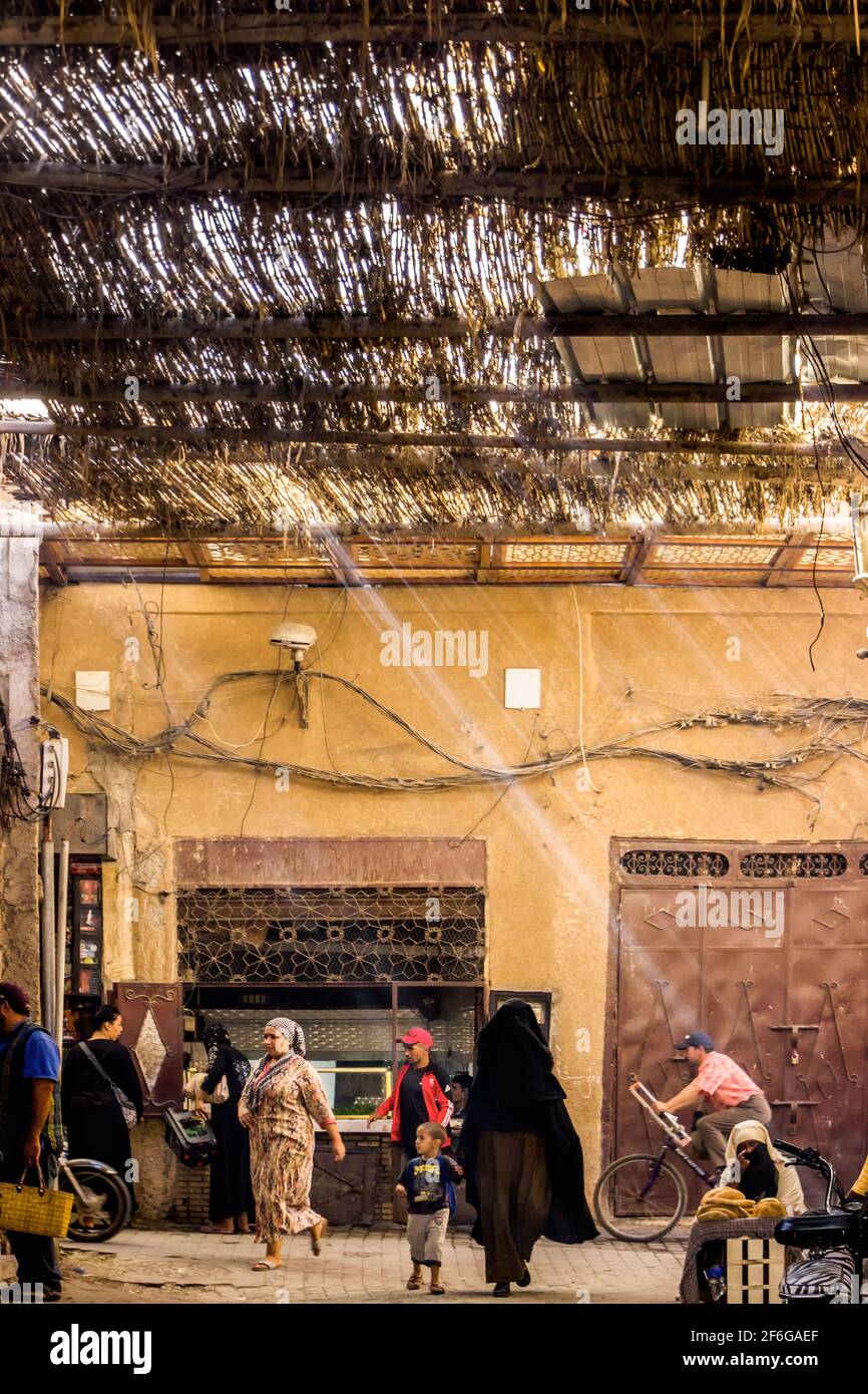 street view of people at old medina in Marrakech Stock Photo - Alamy