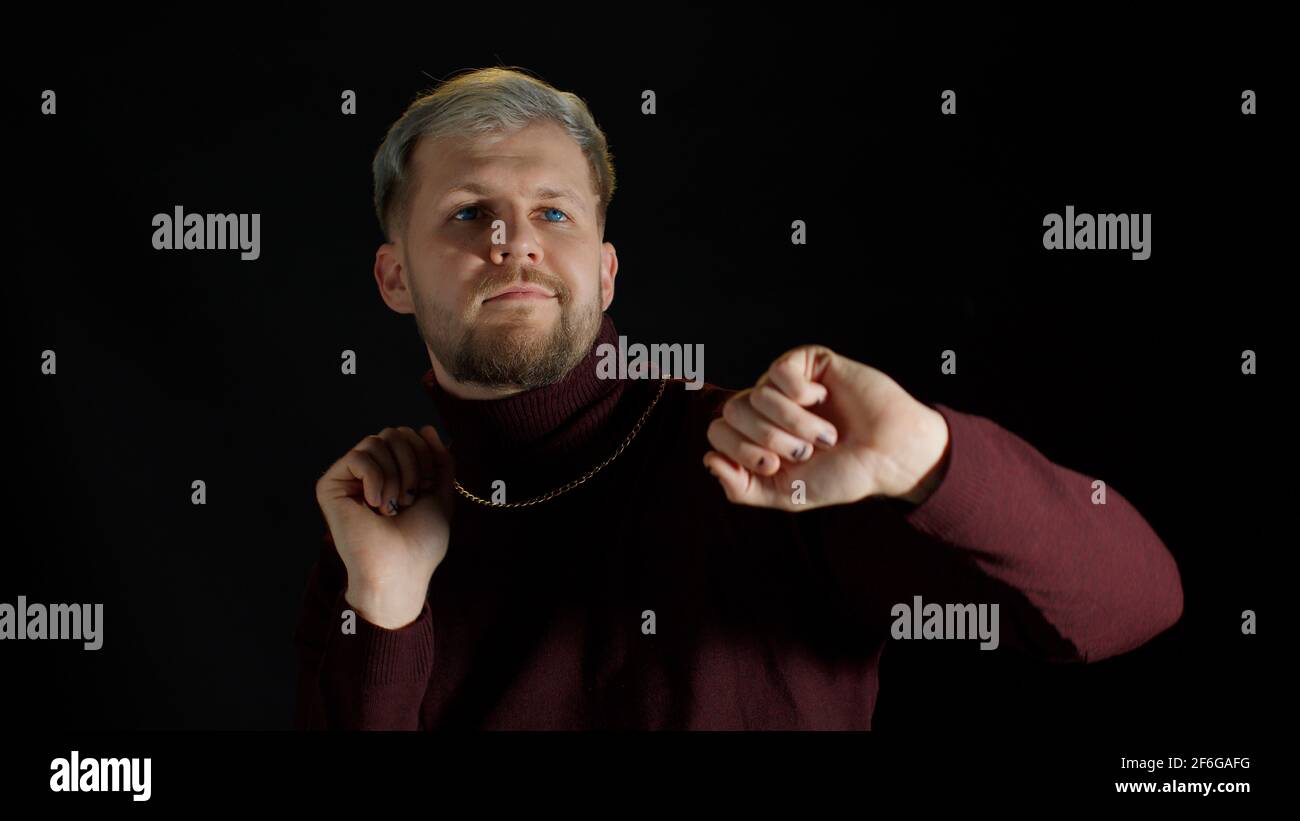 Handsome disco dance man dancing to music rhythmically, moving hands on ...