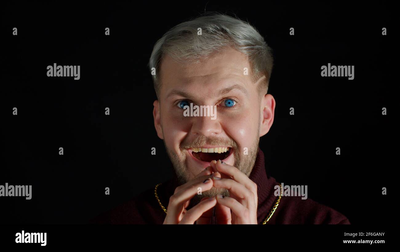 Sly man scheming, thinking over tricky plan with cunning expression ...