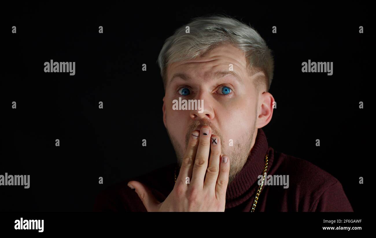 Exited shocked shy man in trendy stylish clothes looking around smile ...