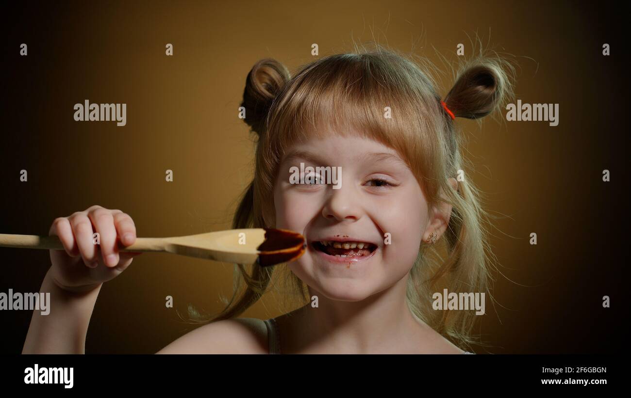 Girl licking candy hi-res stock photography and images - Alamy