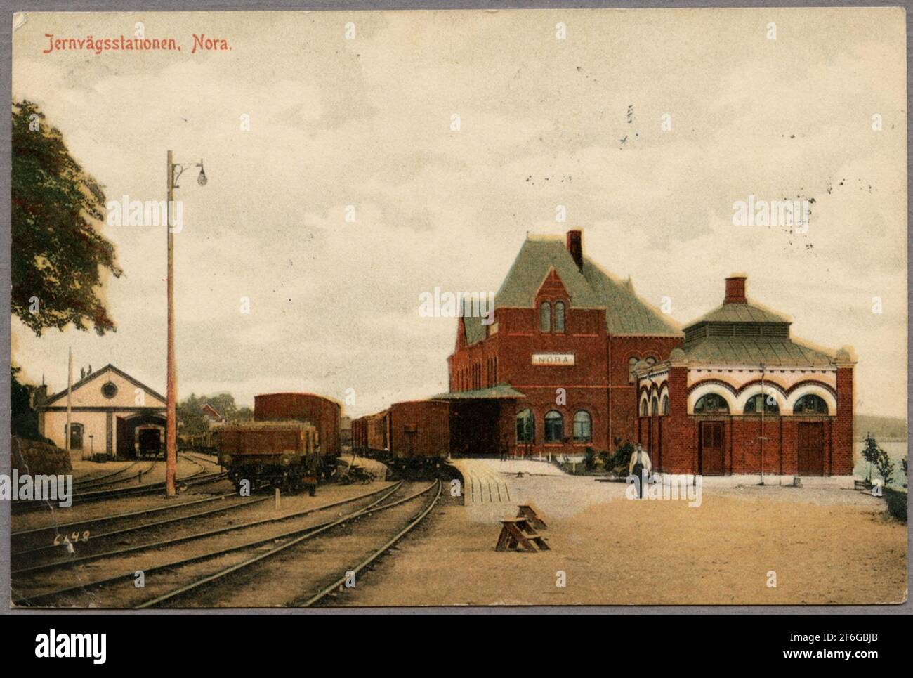 View on station area and railway yard with carts and staff in picture ...