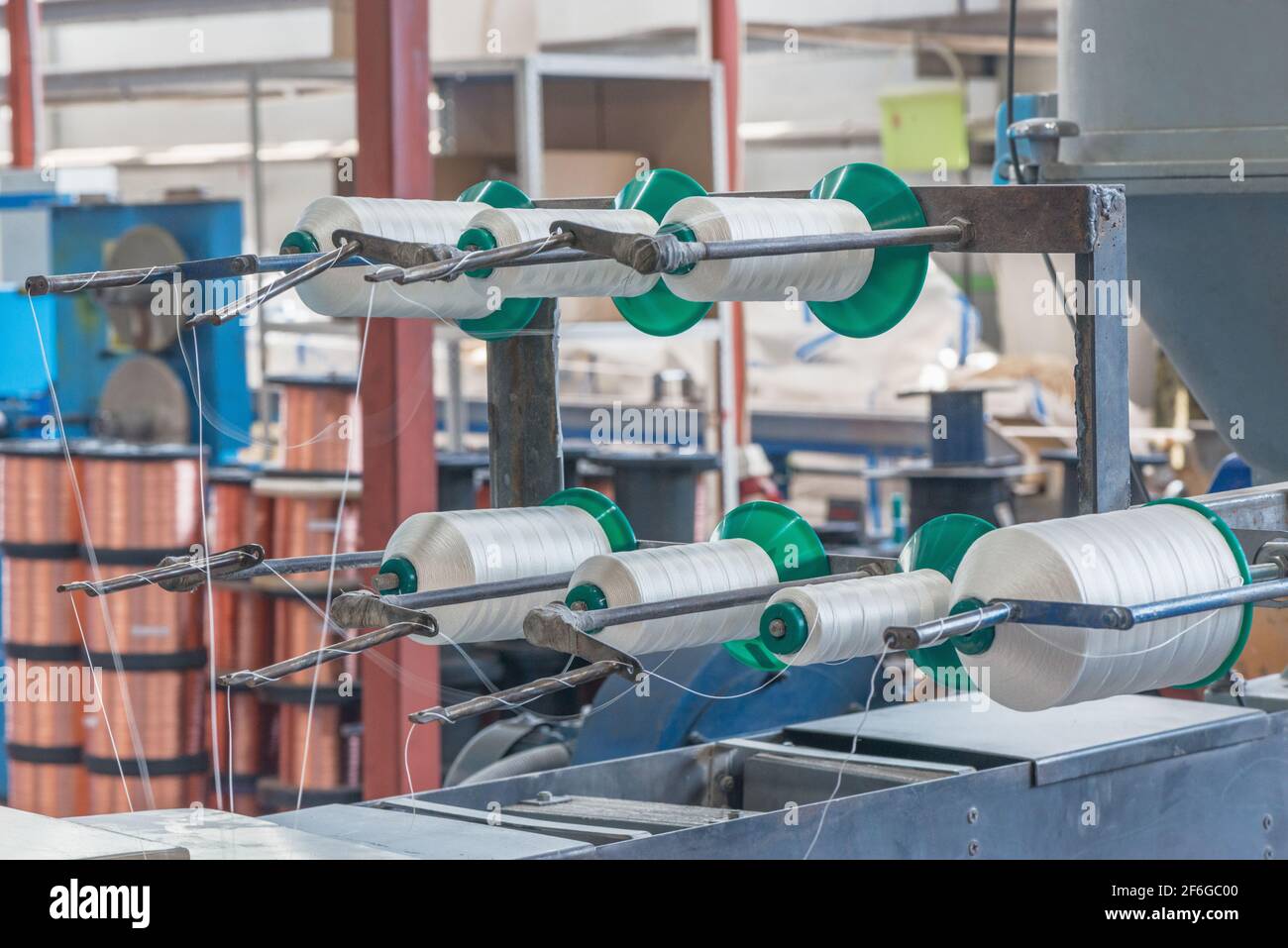 Spools of thread inside of the plant Stock Photo - Alamy