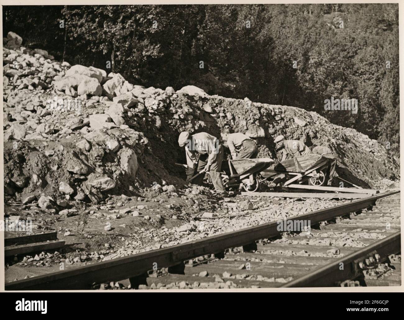 Clearing work after landslides near Straumsnes on the line between the ...