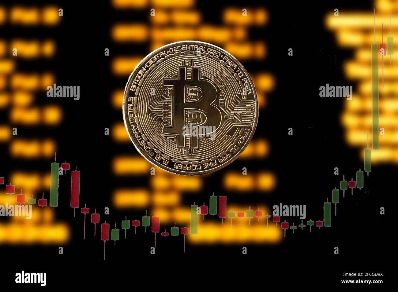 bitcoin on blur charts background Stock Photo - Alamy