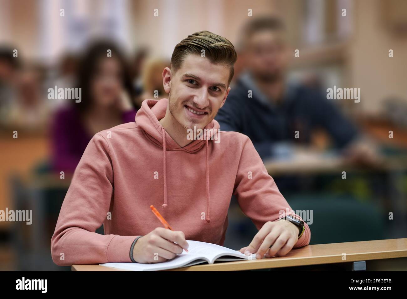 student taking notes while studying in high school. Portrait of college ...