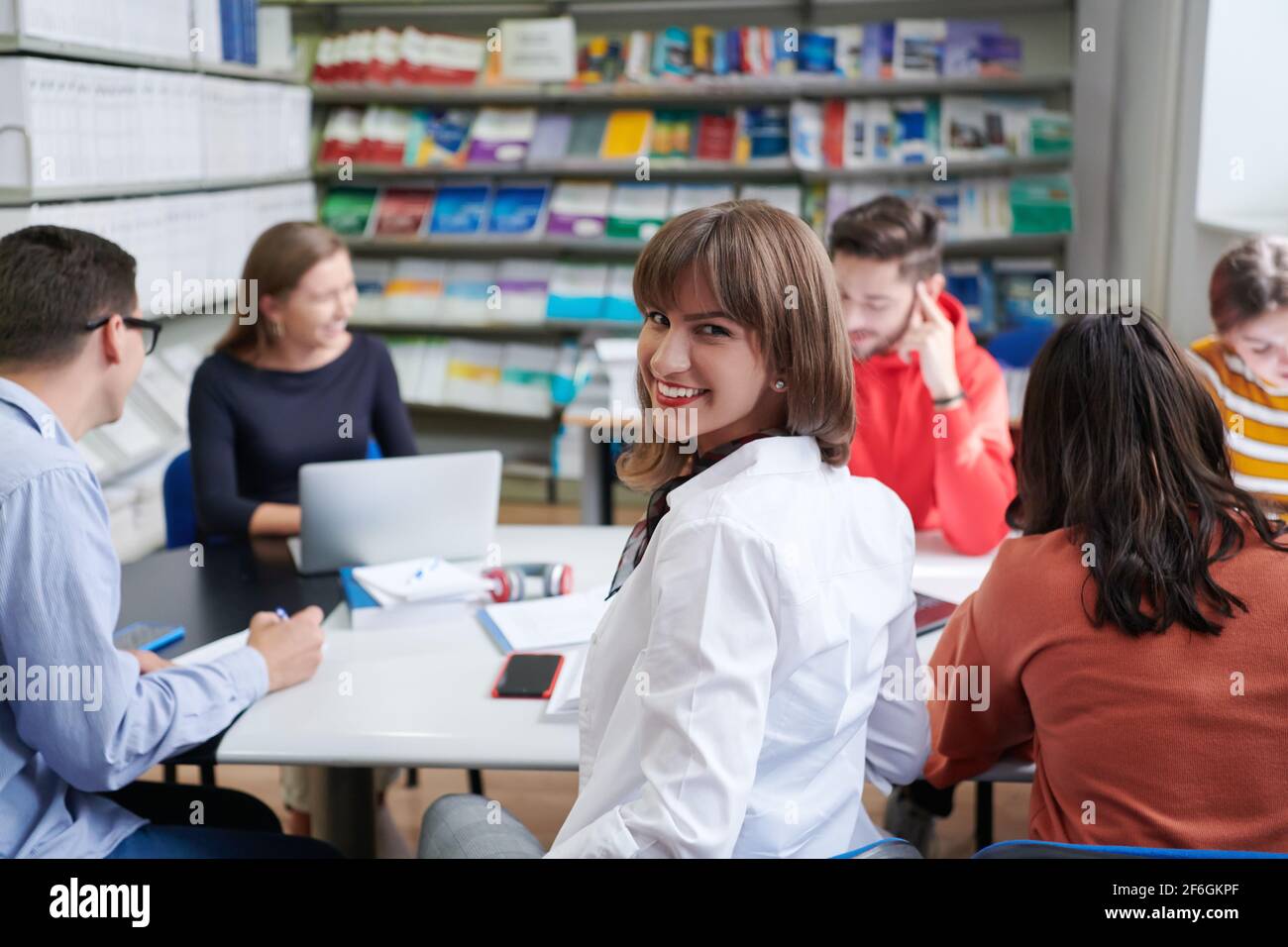 students in a modern environment work together to more easily complete ...