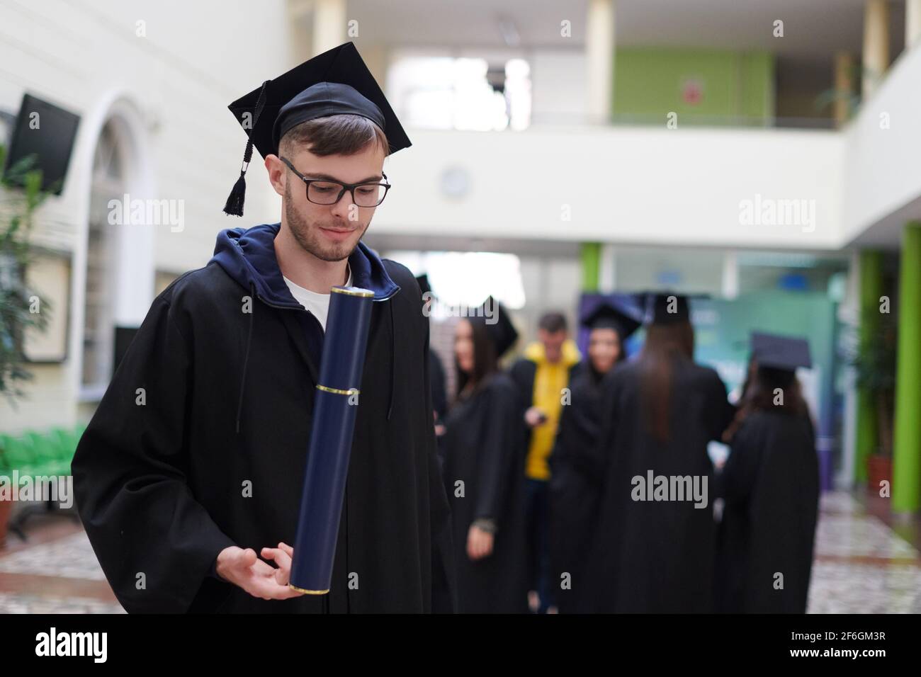 Happy man portrait on her graduation day University. Education and ...