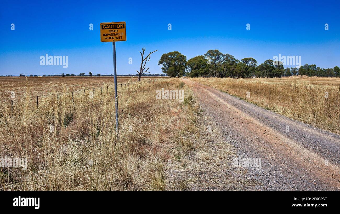 Wet Road Impassable Sign on Dry Dirt Road Stock Photo - Alamy